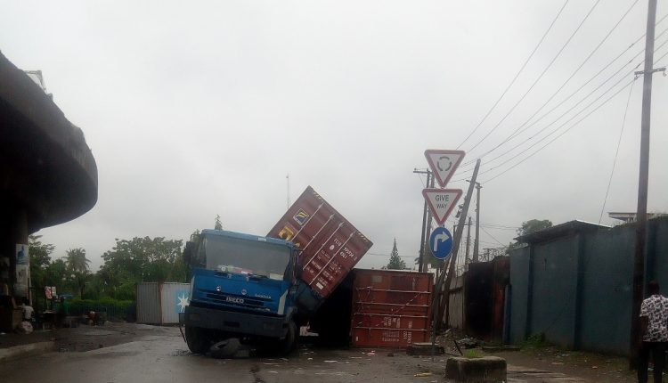 One fall too many: Container falls off truck at Liverpool, Lagos ...